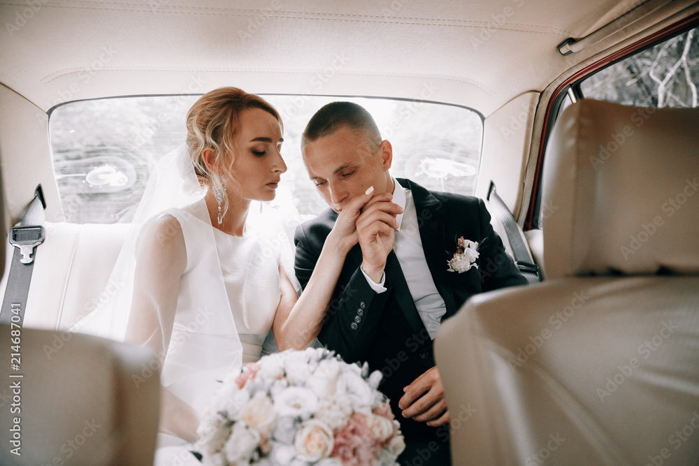 Wedding photo in the car.The bride and groom in a retro car. Stock ...