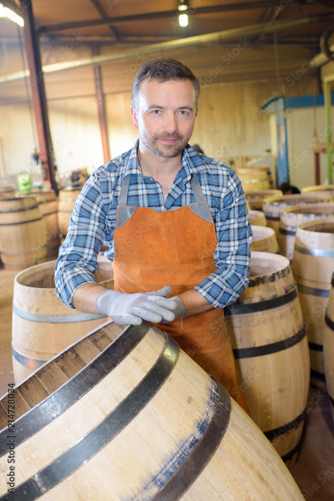 wood barrels production cooper using hammer and tools in workshop Stock ...