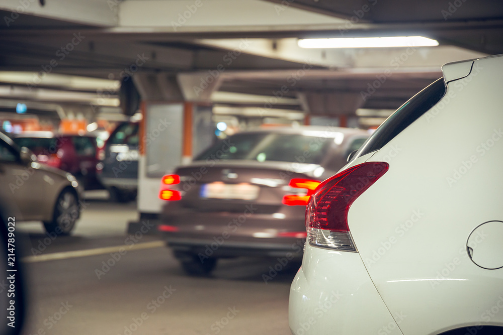 Underground car parking. Different cars standing at underground parking ...