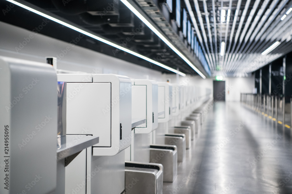 Interior of check-in area in modern airport: luggage accept terminals ...