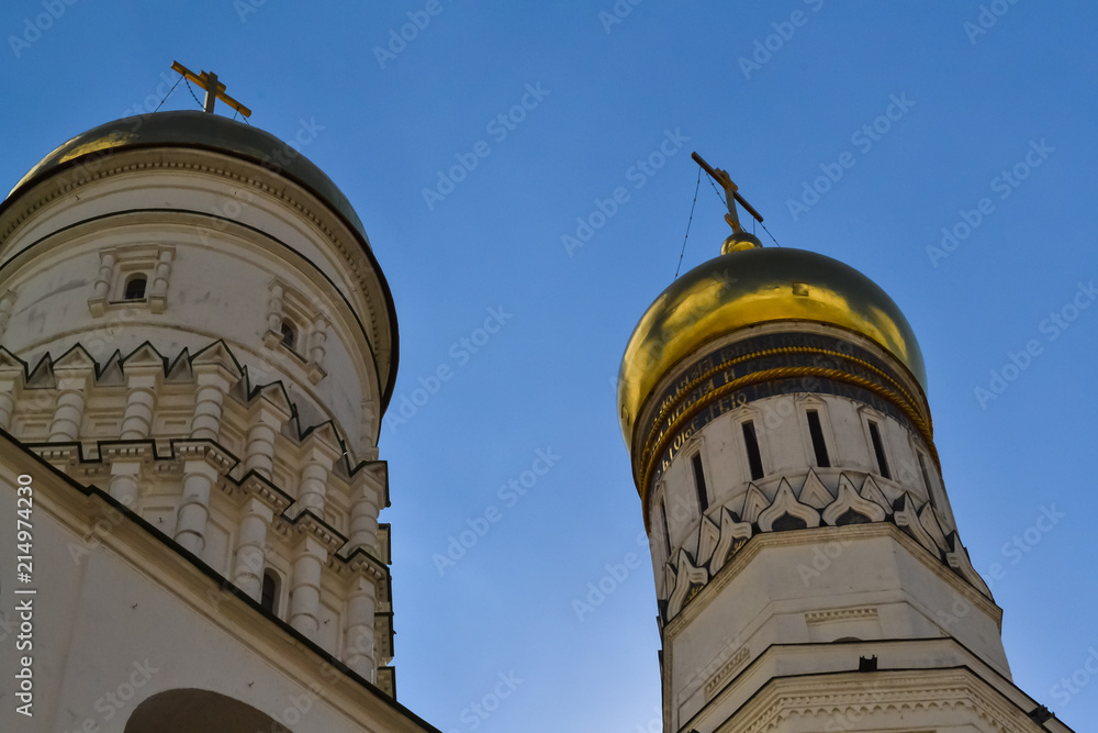 The dome of the bell tower of Ivan the Great opposite the blue sky ...