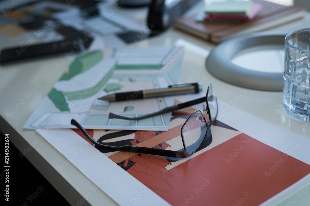 Architectural chart and spectacle on desk Stock Photo | Adobe Stock