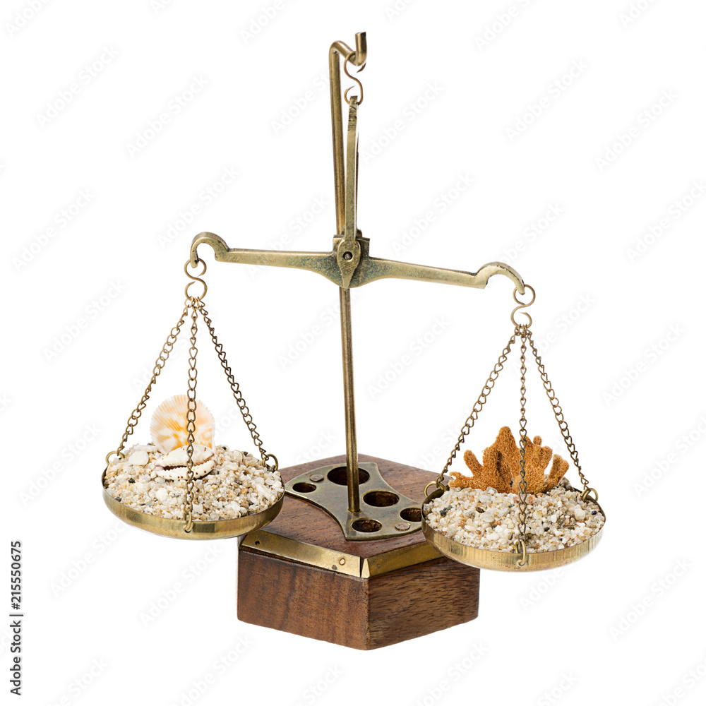 Scales of justice with sand and sea shells over white background for ...