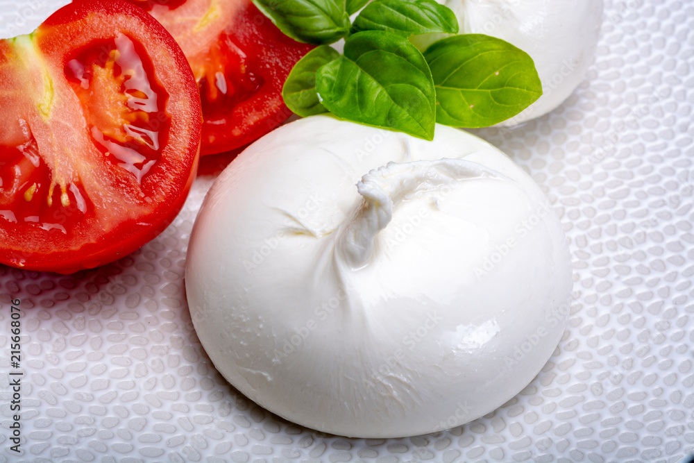 Fresh soft white burrata, ball buttery cheese, made from a mix of ...