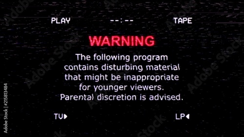 An old noisy VHS tape screen showing a warning message: the following ...