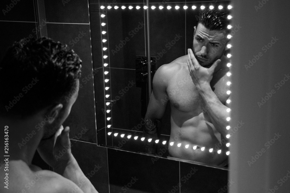 Handsome Sexy Topless Shirtless Man Stands In Front Of Bathroom