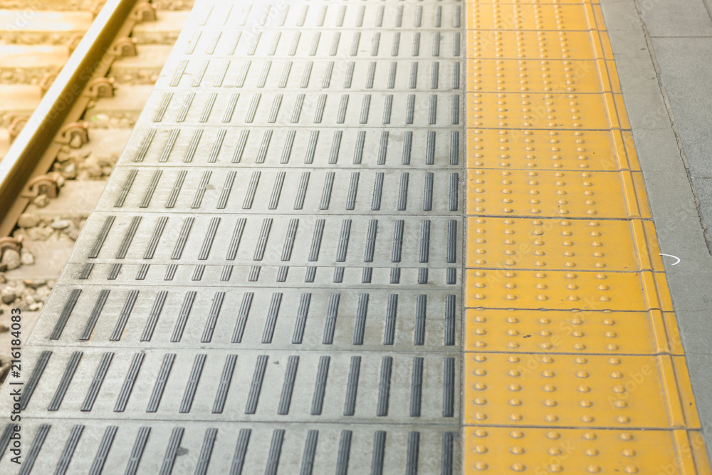 Tactile paving for blind handicap on tiles pathway, walkway for ...