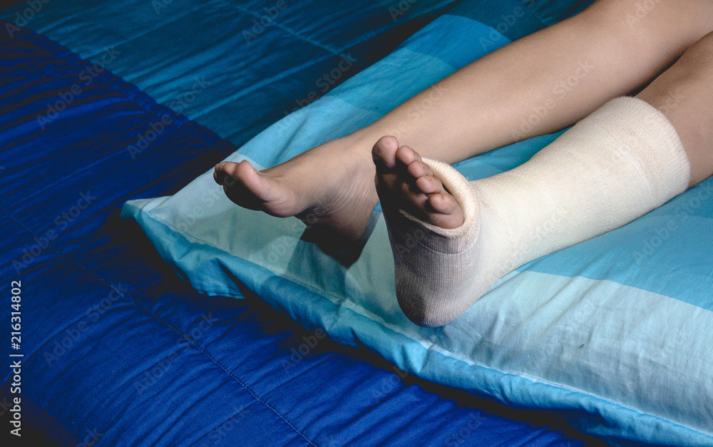 Ankle strap for treating torn wound of foot injury. On the blue floor ...