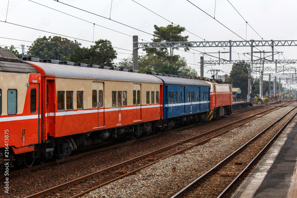 Passenger and cargo locomotive at the train station in Taiwan. Railroad ...