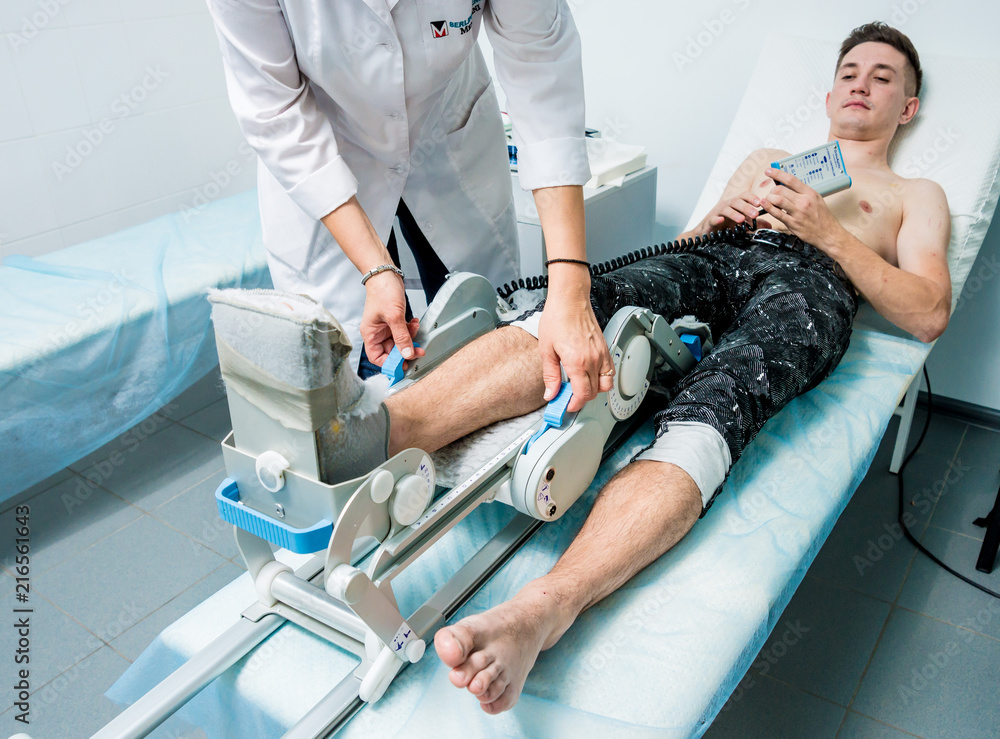 Patient on CPM (continuous passive range of motion) machines. Stock ...