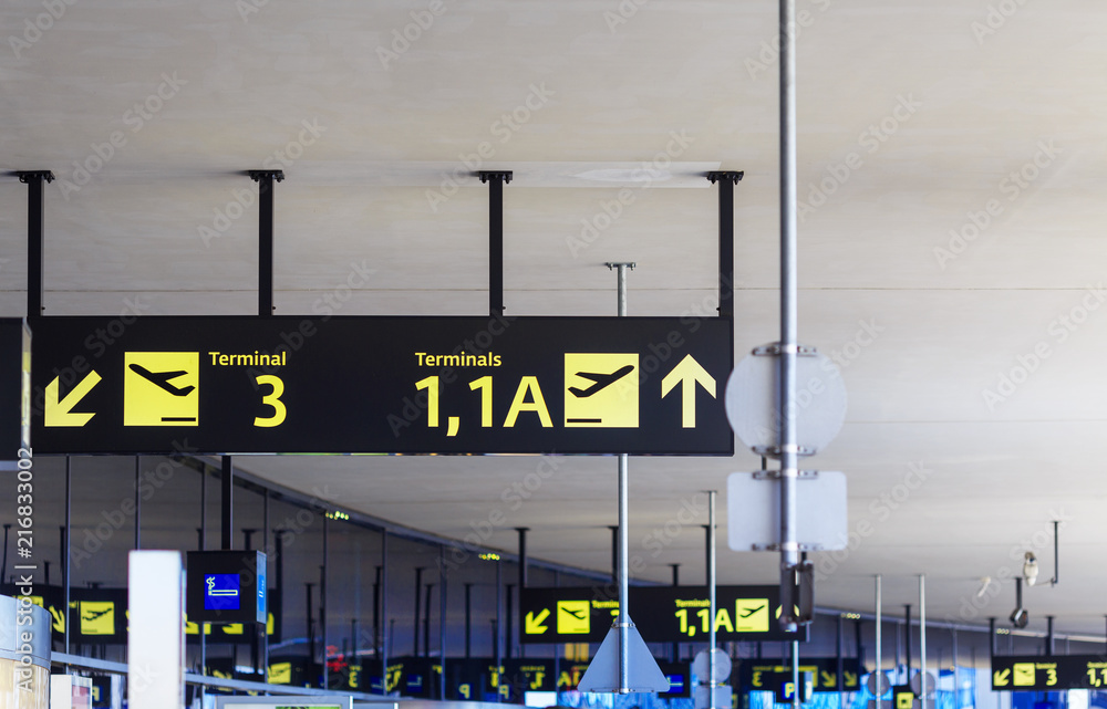 Typical information sign boards with arrows, arrival and departure ...