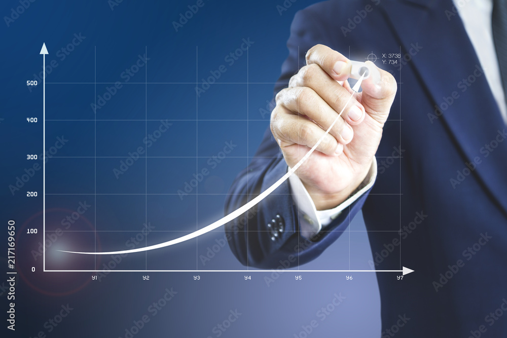 Businessman drawing an exponential curve of a progress in business ...