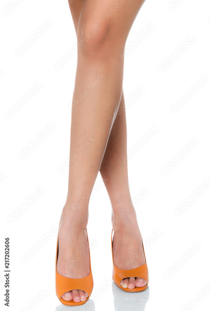 Woman beautiful long legs, stretching crossing legs pose and feet ...