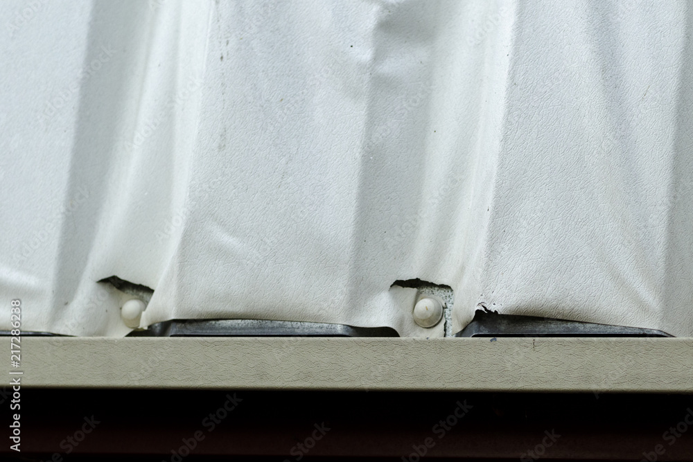 Foto de Stock External cladding coating dis bonding and flaking off ...