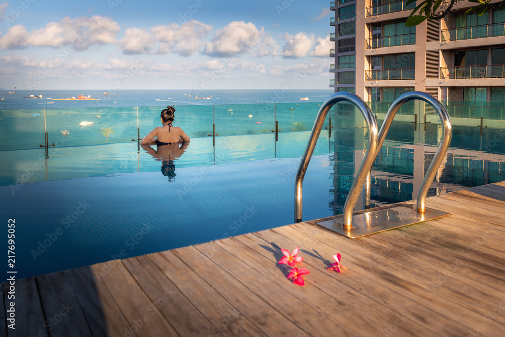 Sexy Woman in Swimsuit is Relaxing in Swimming Pool, Beautiful Asian ...