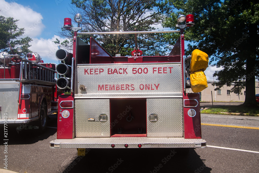 Back of red fire truck with the words Keep Back 500 Feet and Members ...
