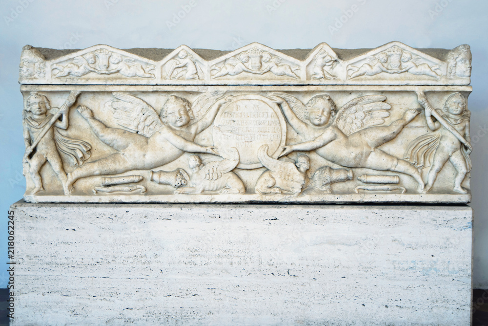 Bas-relief of an ancient Roman sarcophagus depicting cupid angels in ...