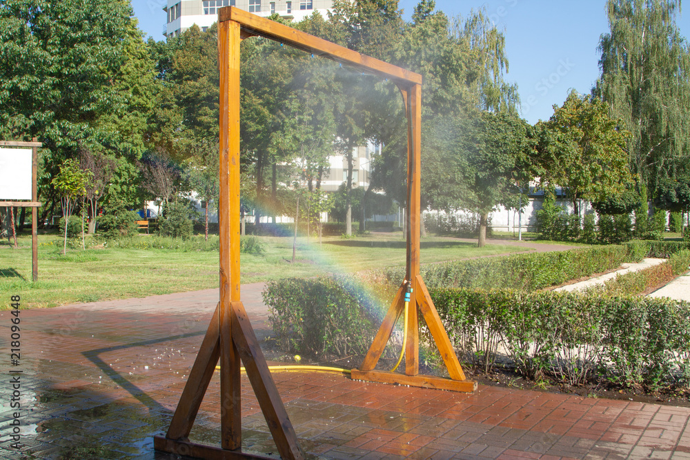 The cooling frame on a hot day created a rainbow. The water spray frame ...