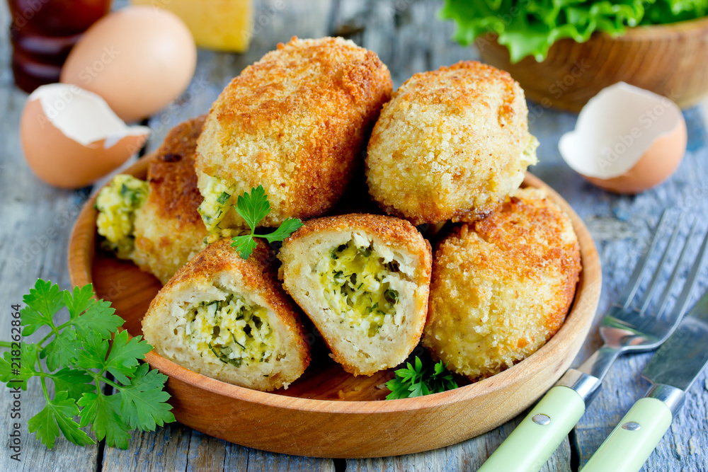 Chicken cutlets with cheese, egg, parsley, butter filling. Traditional ...