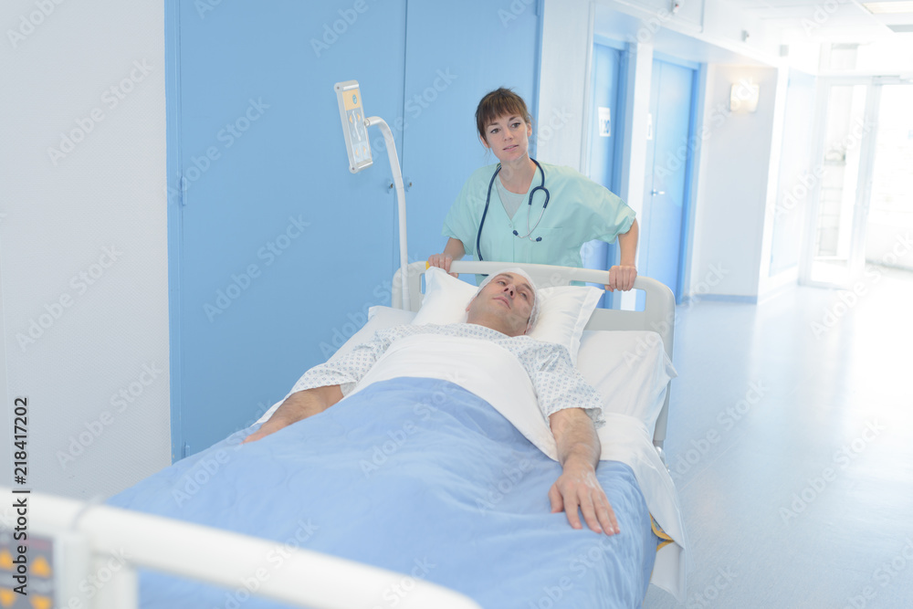nurse transferring the patient to the recovery room Stock Photo | Adobe ...