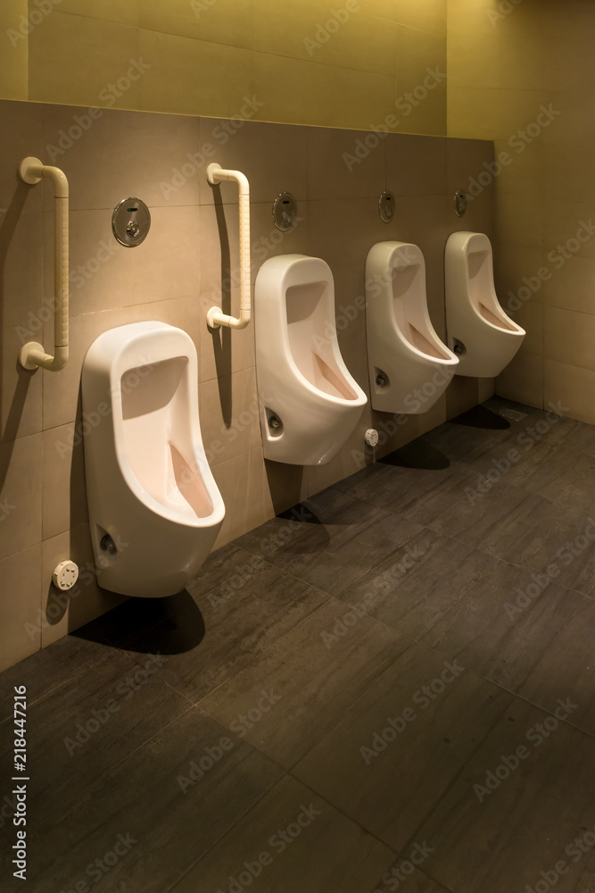 Row of white ceramic urinal chamber pot interior design men and ...