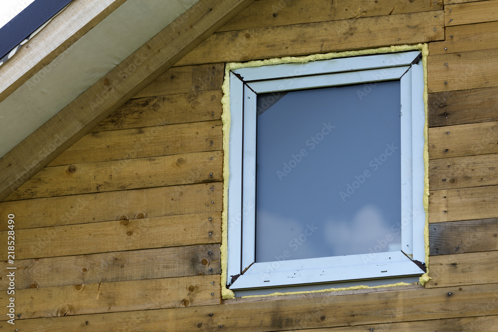 Close-up detail of new narrow plastic vinyl window installed in house ...