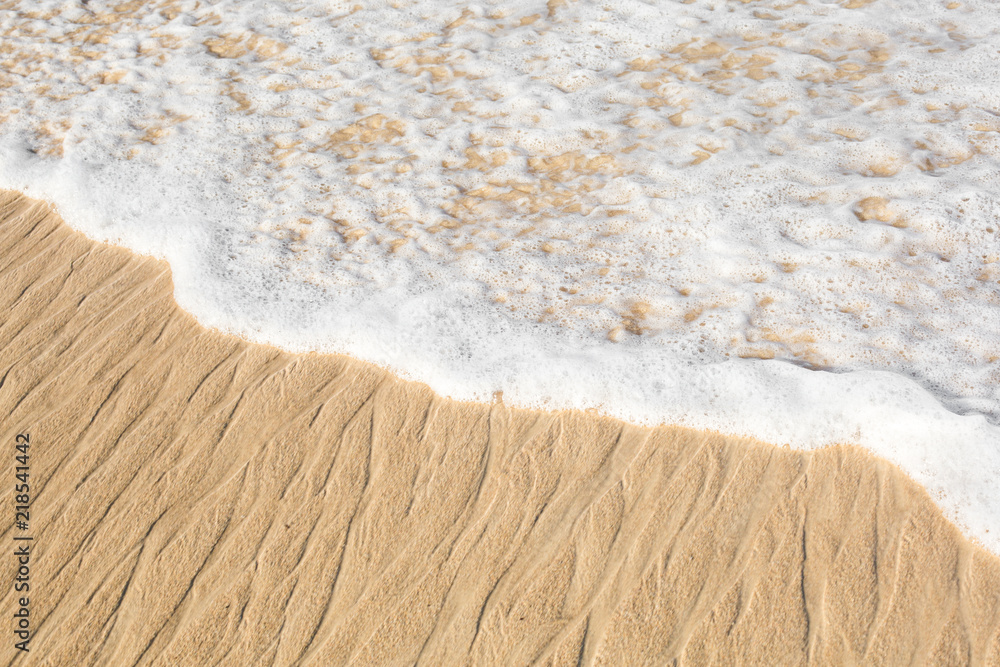 ocean surf line yellow sand and waves on the tropical beach in ...