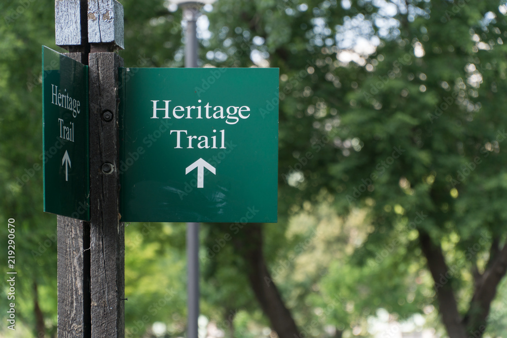 Heritage Trail sign on wood post marking symbol for nature hike walk ...