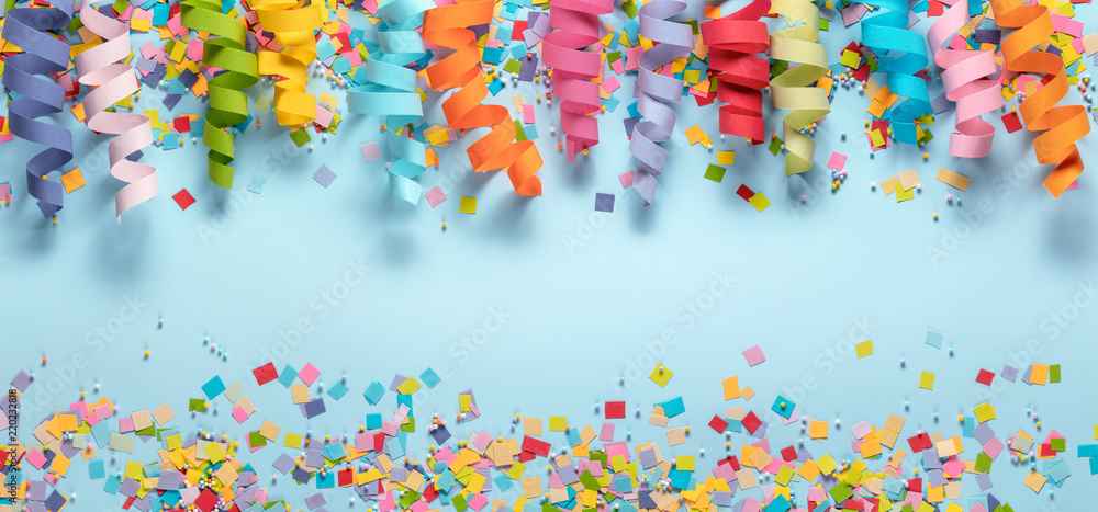 Streamers and confetti on blue background.Birthday decoration. Stock ...