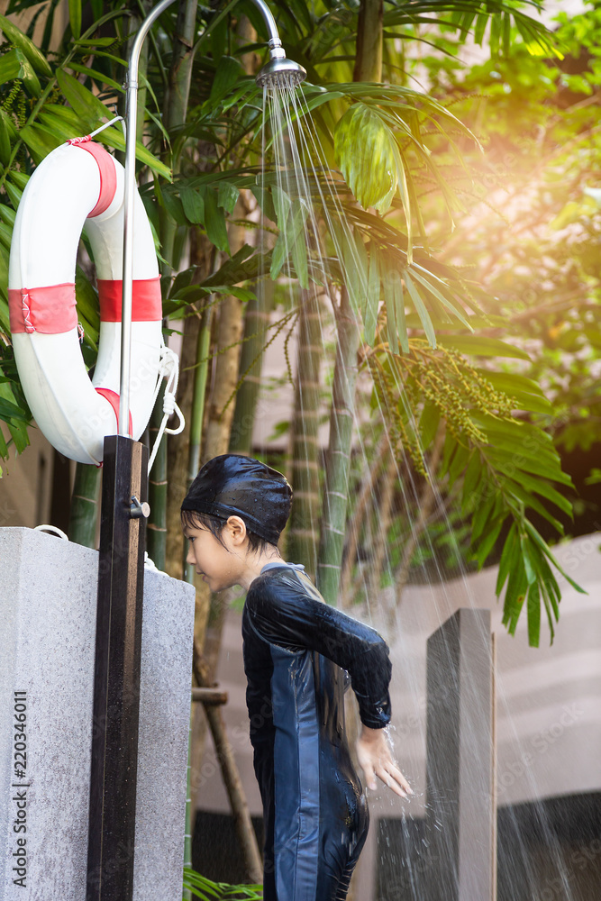 Asian cute girl under the shower cleaning body ang skin outdoor shower ...