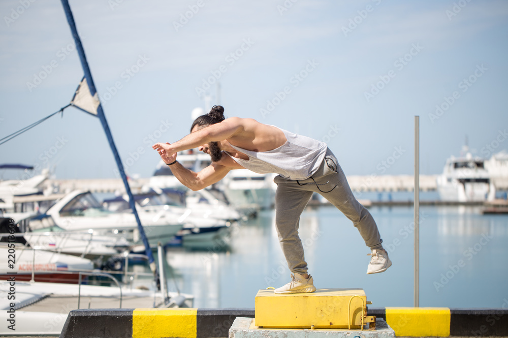 Muscular caucasian athlete increasing power with plyometric workout ...