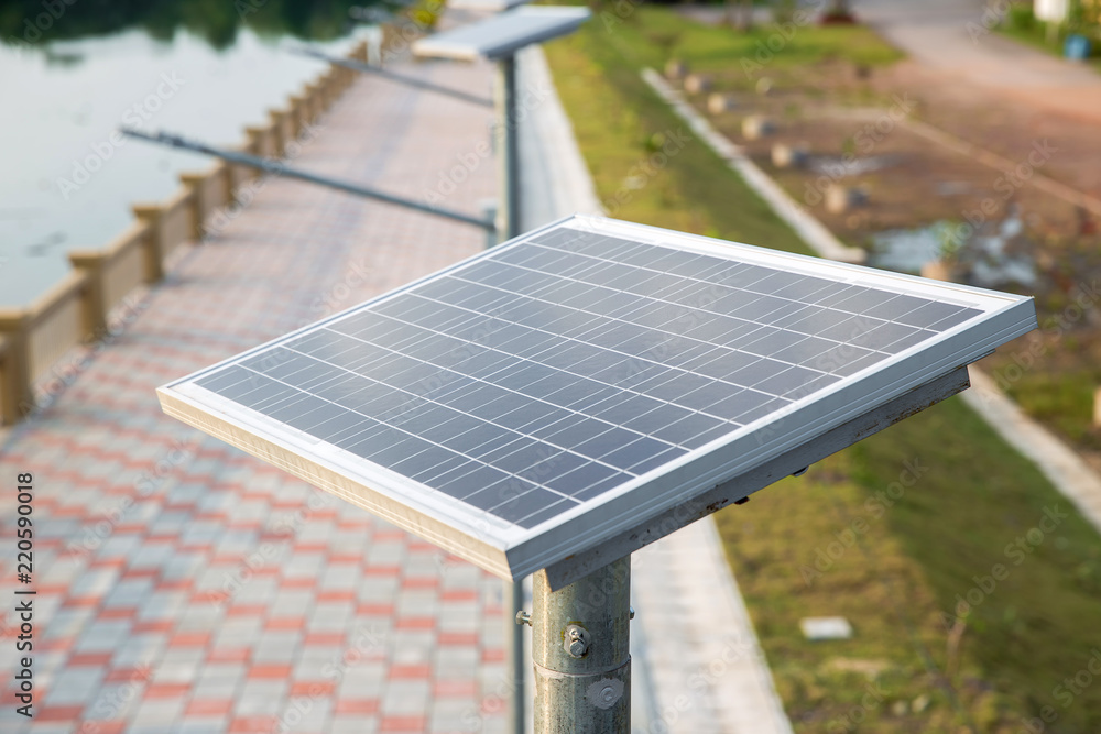 Solar cell plate on the walk way beside the river. solar energy for ...