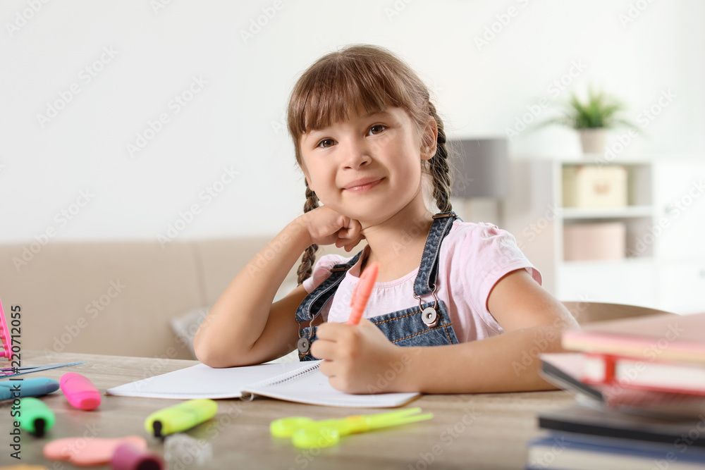 Little girl doing assignment at home. Stationery for school Stock Photo ...