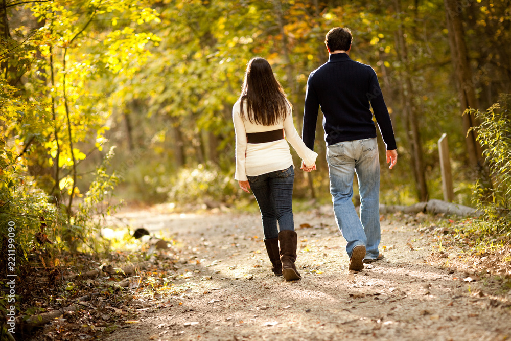 Couple Holding Hands Walking in Autumn Woods Stock Photo | Adobe Stock