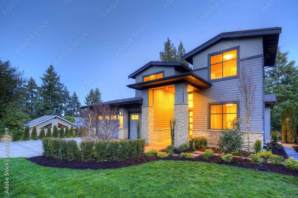 Grey luxury modern two story tall house exterior with stone columns ...