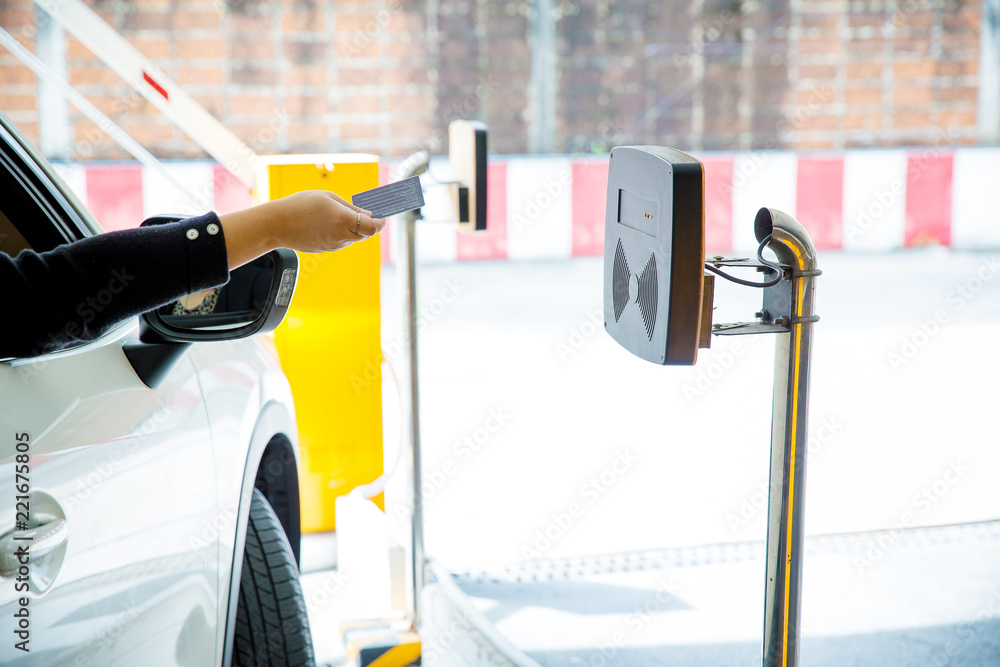 Hand held card to the scanner to open the car park door. security system for parking. image for ...