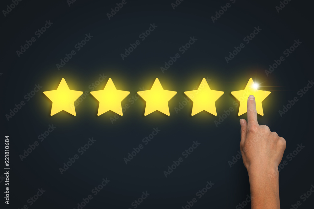 Female hand leaves a rating of Five stars out of five possible a Stock ...