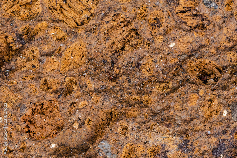 Colorful abstract background of volcanic tuff rock. Warm colored ...