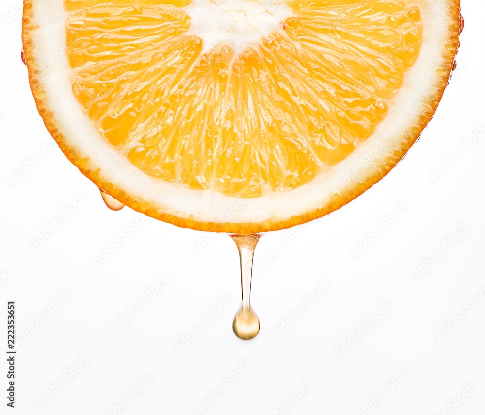 Orange slice dripping juice Stock Photo | Adobe Stock