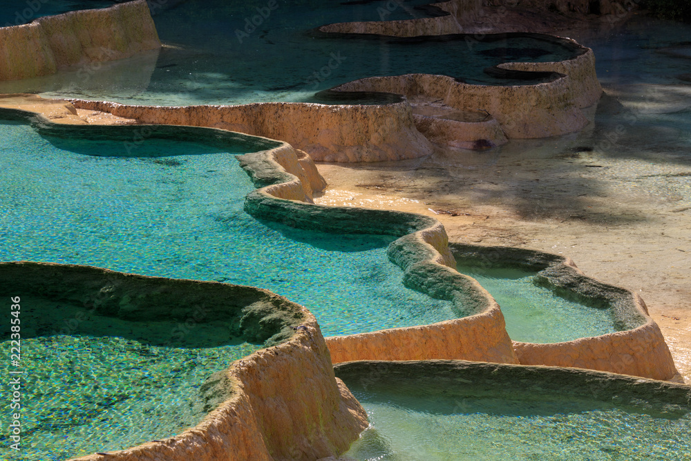 Blue colorful pools of clear water in Huanglong Scenic Area in Sichuan ...