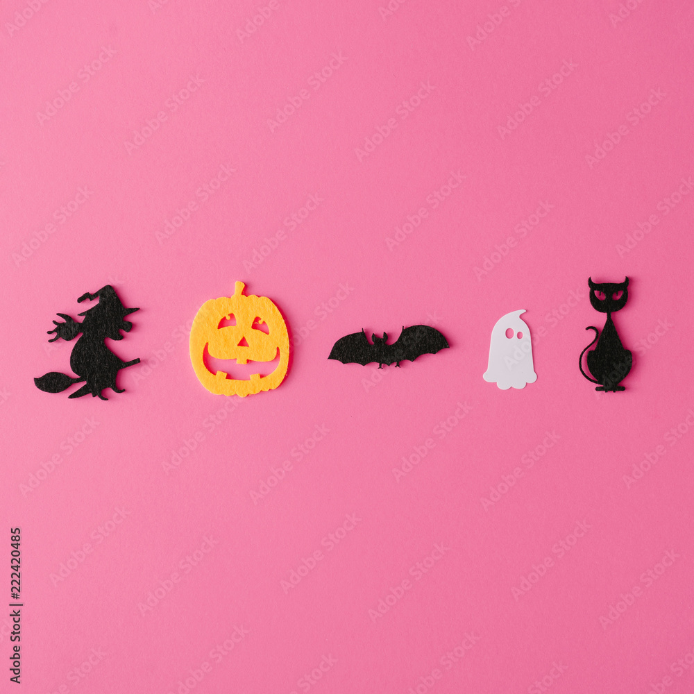 Creative pink layout made with Jack-o'-lantern, witch, bat, cat, and ...