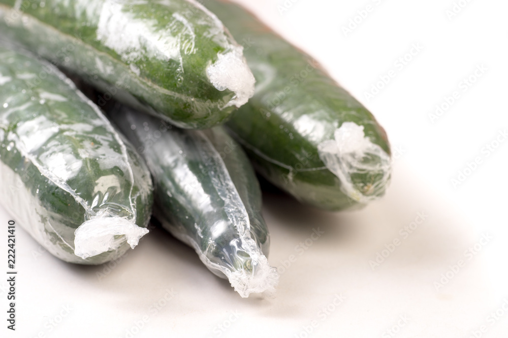 Bunch of cucumber wrapped in plastic films Stock Photo | Adobe Stock