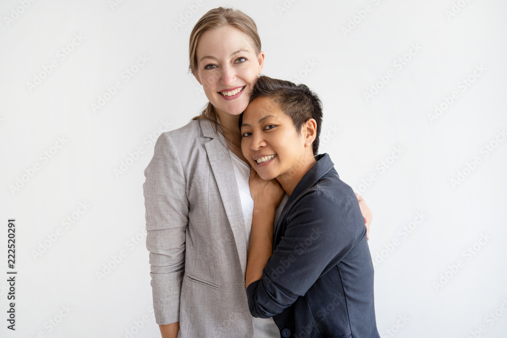 Happy multi-ethnic lesbian couple hugging. Homosexual women. Lesbian ...