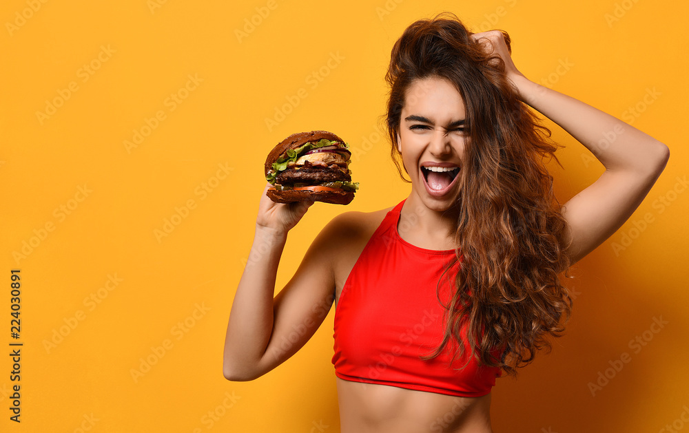 Woman hold big barbecue burger sandwich with hungry mouth happy ...