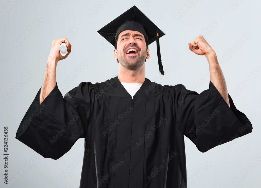 Man on his graduation day University celebrating a victory in winner ...