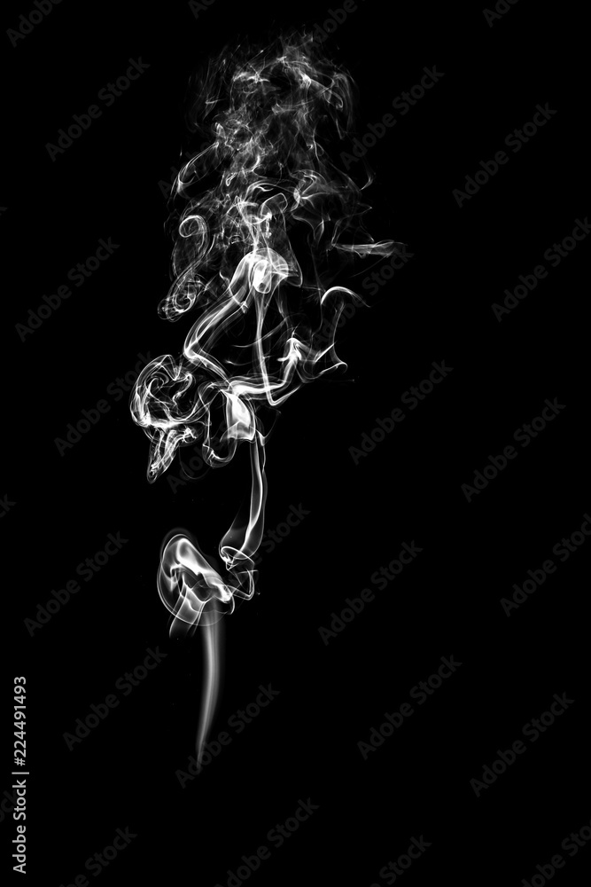 white smoke or dust, wavy and swirly on black background. perfect for ...