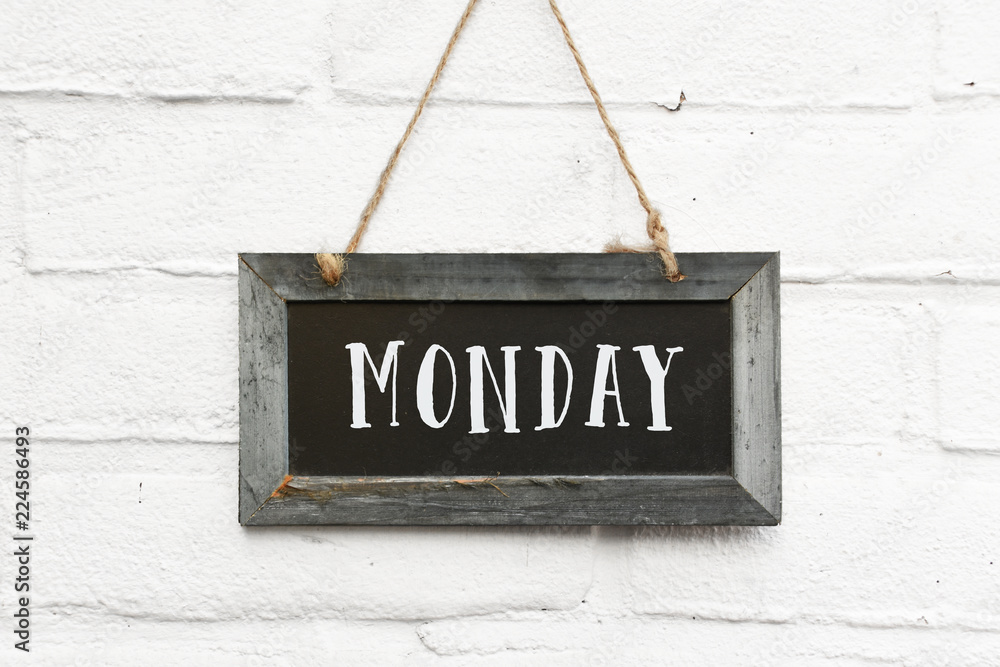Hello monday text on hanging board white brick outdoor wall Stock Photo ...