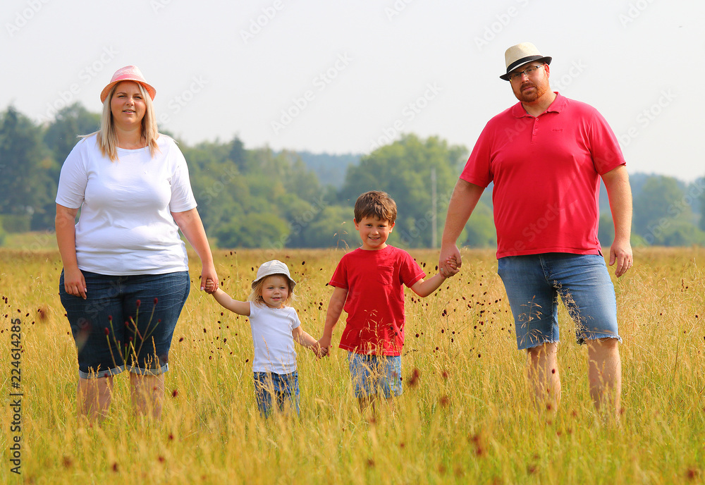 Overweight parents with her children walking together. Family enjoying ...