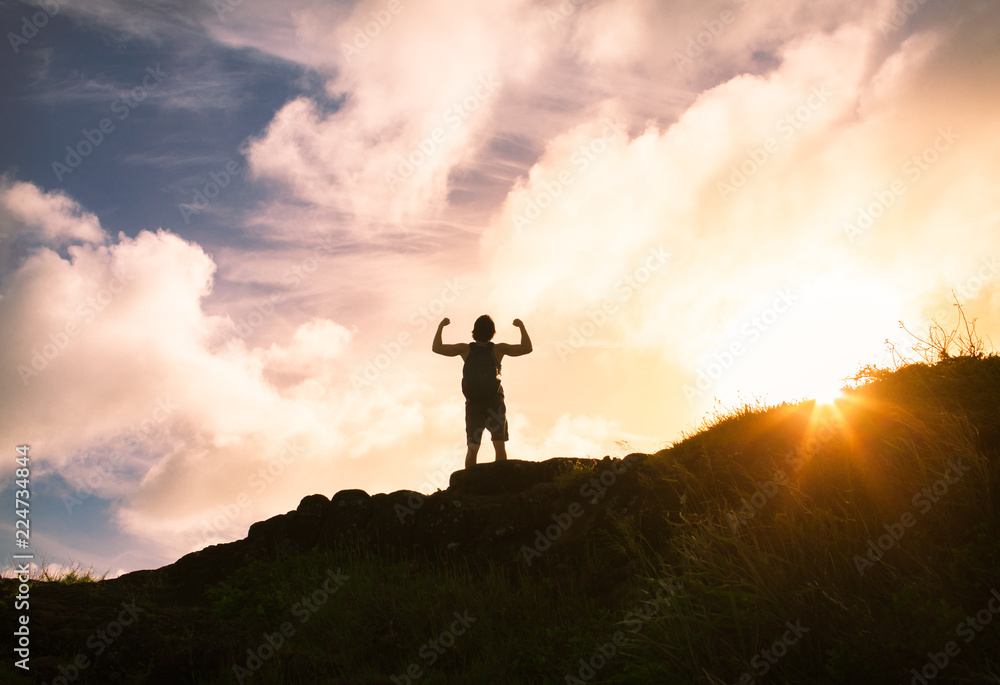 People, power, strength, and determination. Strong male hiker flexing ...