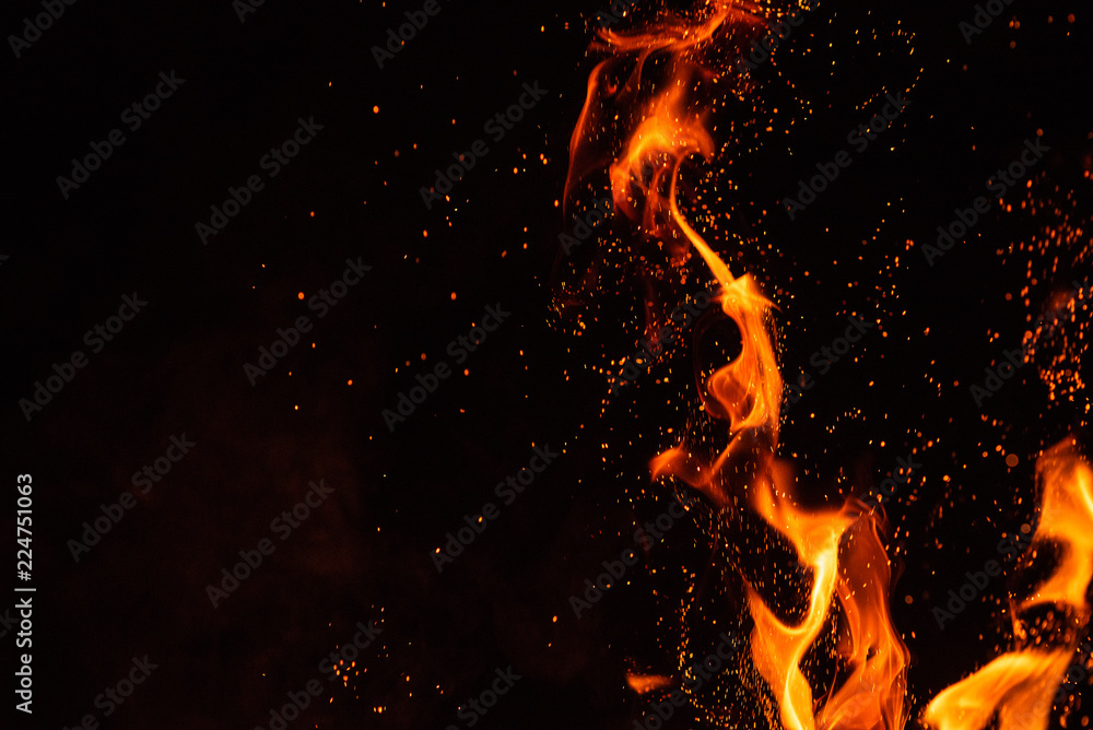 Fiery fire isolated on black isolated background . Beautiful yellow ...